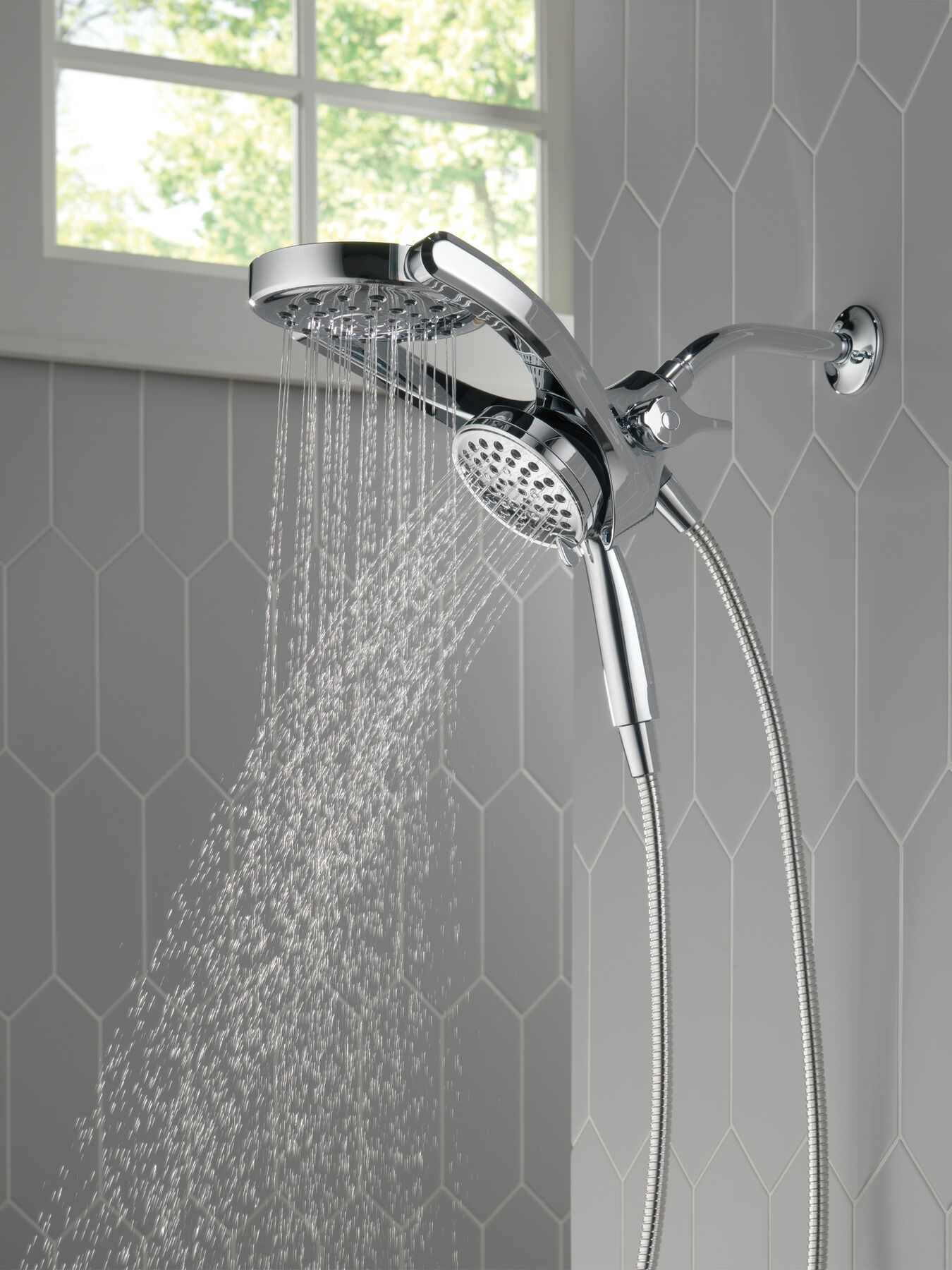 HydroRain® 4-Setting Two-in-One Shower Head in Chrome 75698D | Delta Faucet