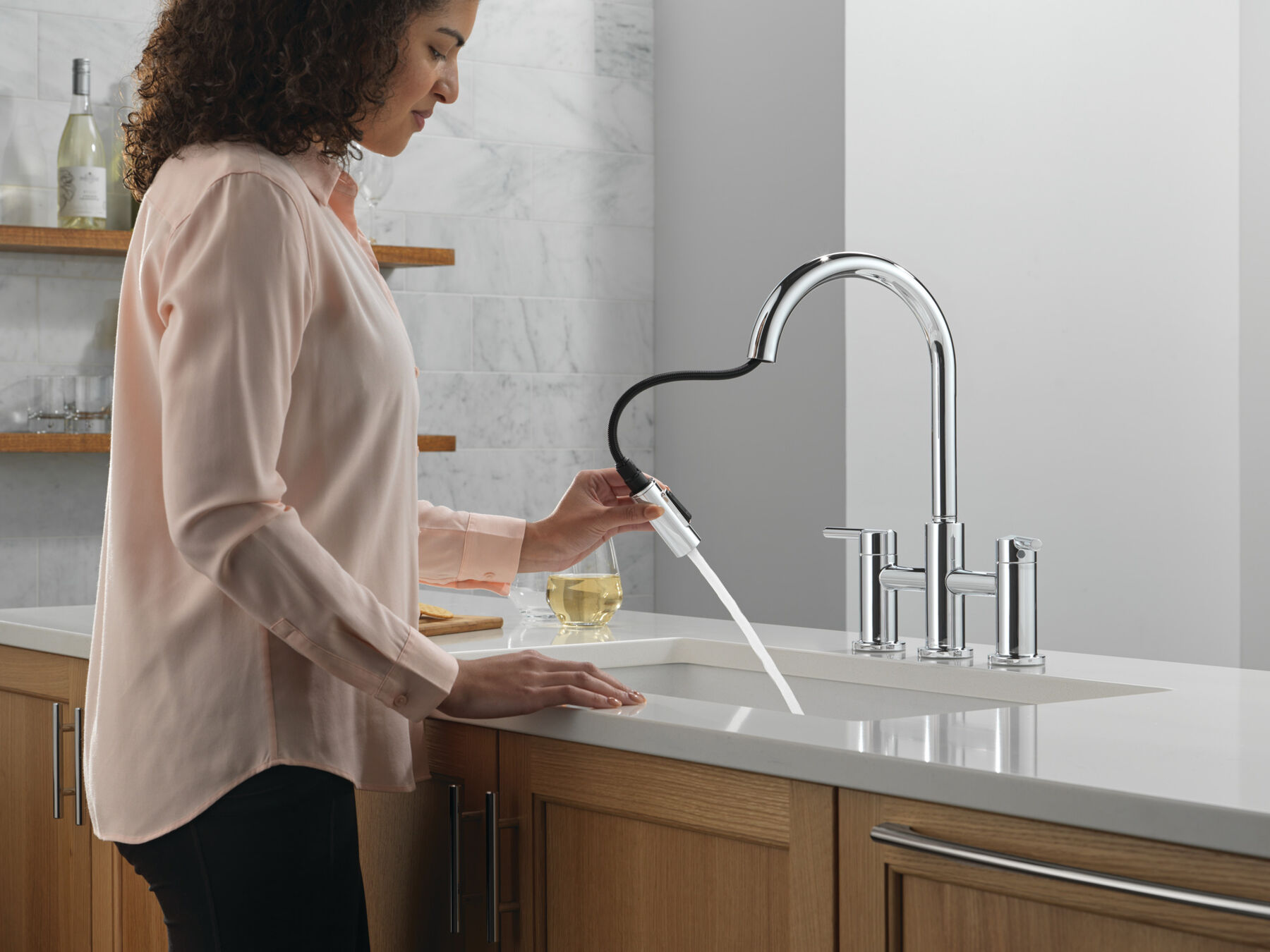 Two Handle Pull-Down Bridge Kitchen Faucet in Chrome 39876LF | Delta Faucet
